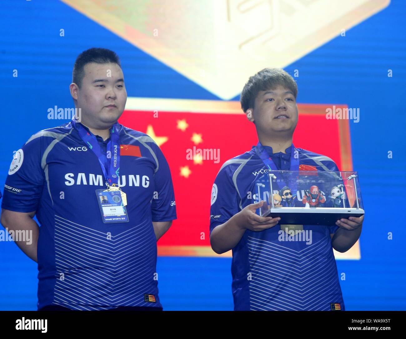Chinese participants pose with their gold medals during the WCG 2019 finals in Xi'an city ...