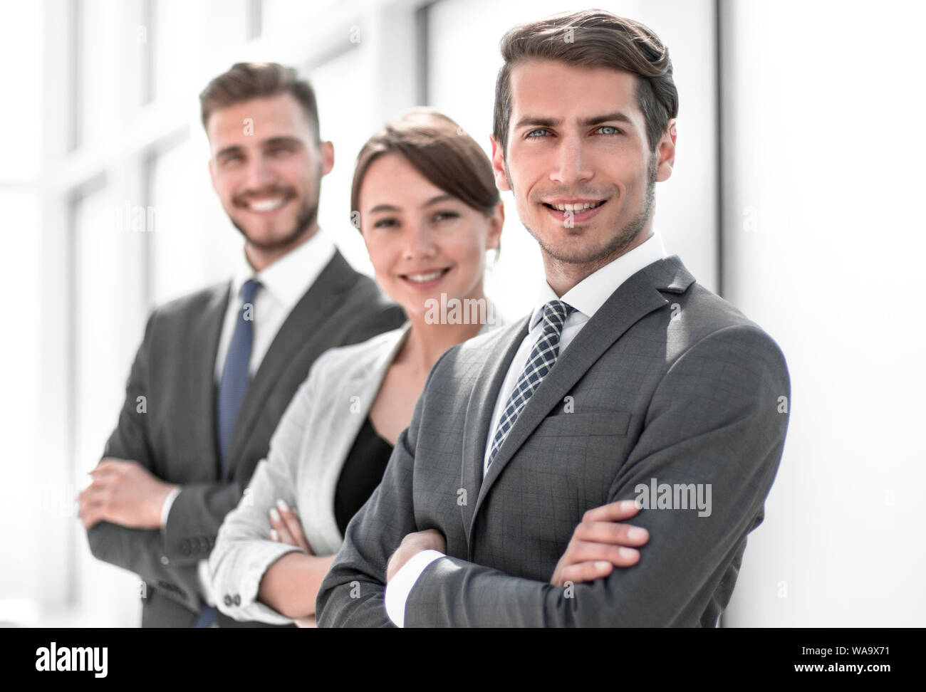young employees standing together Stock Photo - Alamy