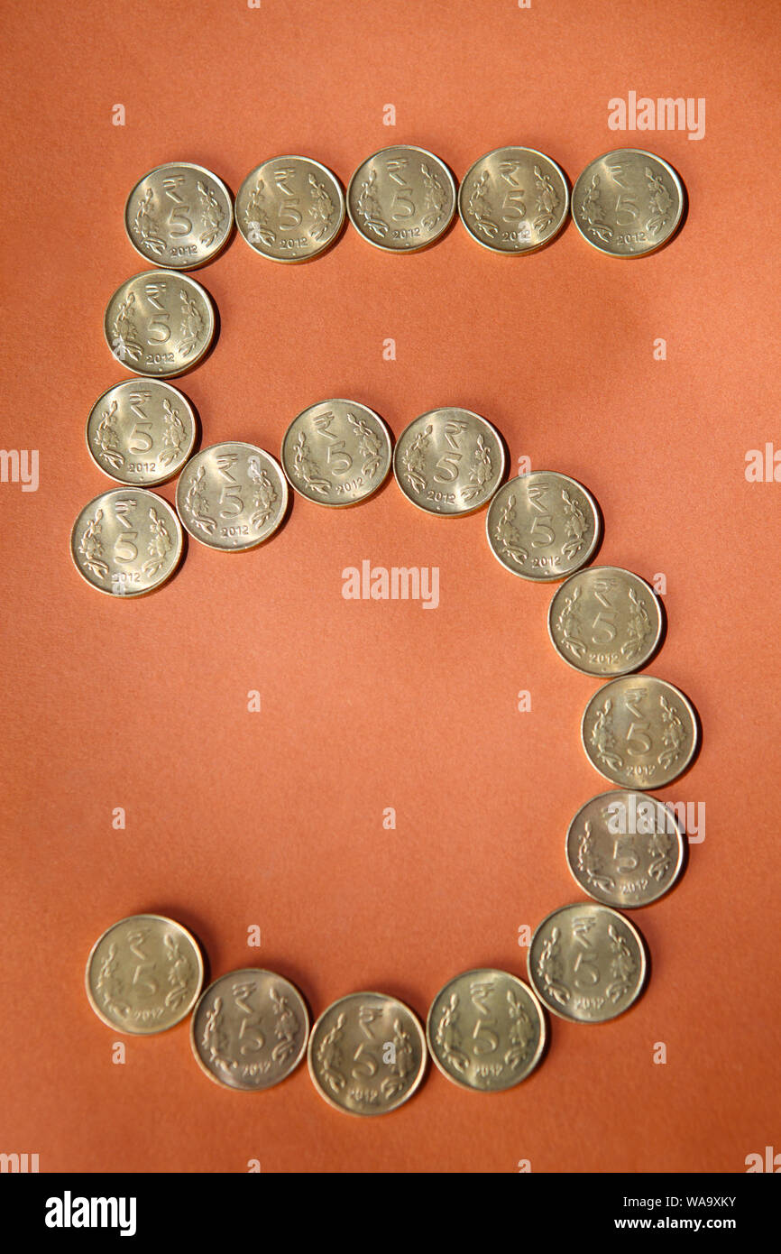 Indian five rupee coin representing number five Stock Photo - Alamy