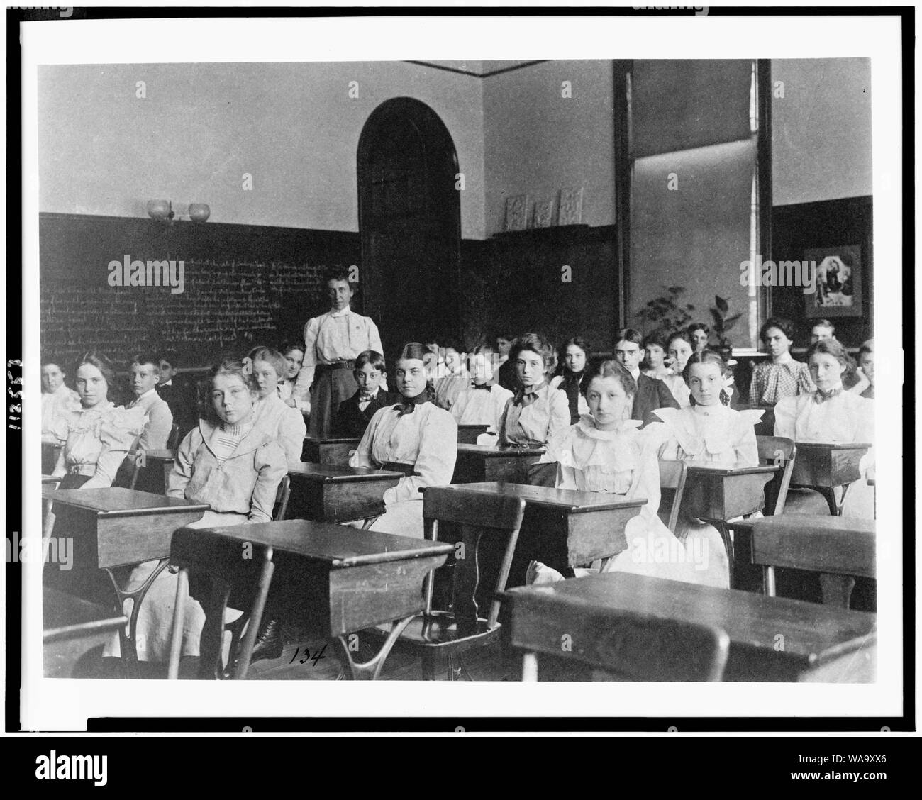 Teacher and students in classroom Cut Out Stock Images & Pictures - Alamy