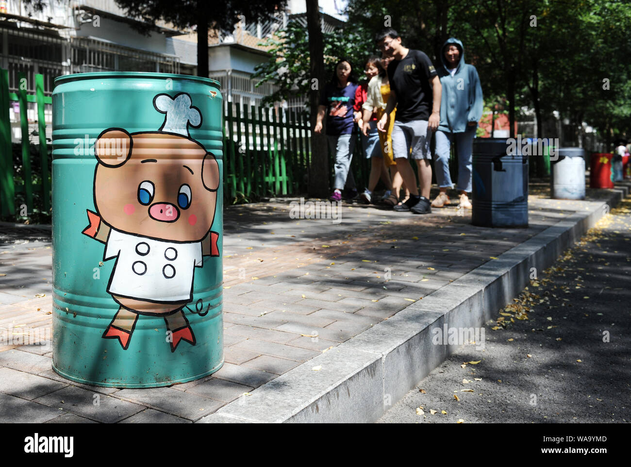 Hundreds of trash bins covered with cartoon characters and tips for ...