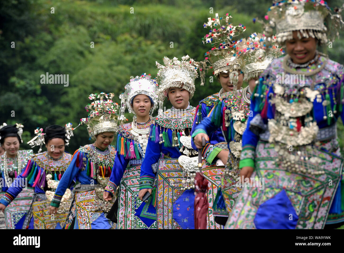 Chinese people of Dong ethnic group wearing traditional costumes and ...