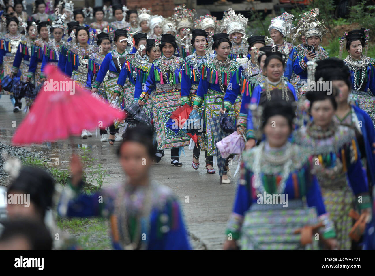 Chinese people of Dong ethnic group wearing traditional costumes and ...