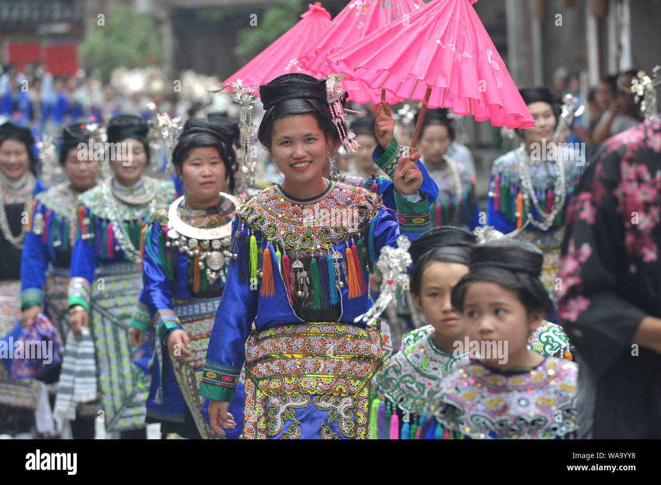 Chinese people of Dong ethnic group wearing traditional costumes and ...