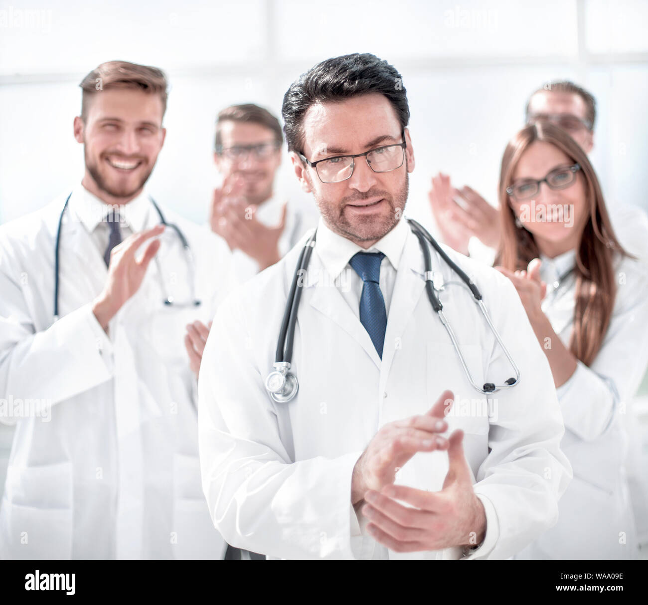 successful doctor, accepting congratulations from colleagues Stock ...