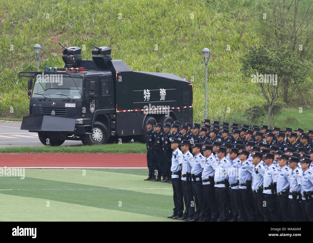 Chinese police officers, including SWAT police officers, take part in a ...