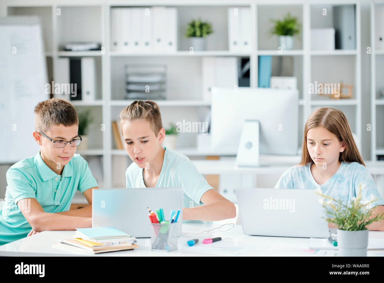 One of clever schoolboys showing his classmate curious website Stock ...