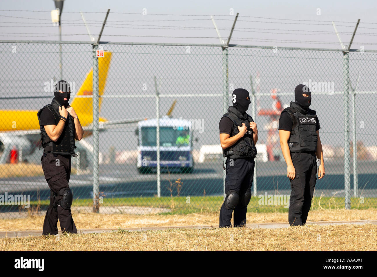 Three customs and border protection officers and Drug enforcement ...