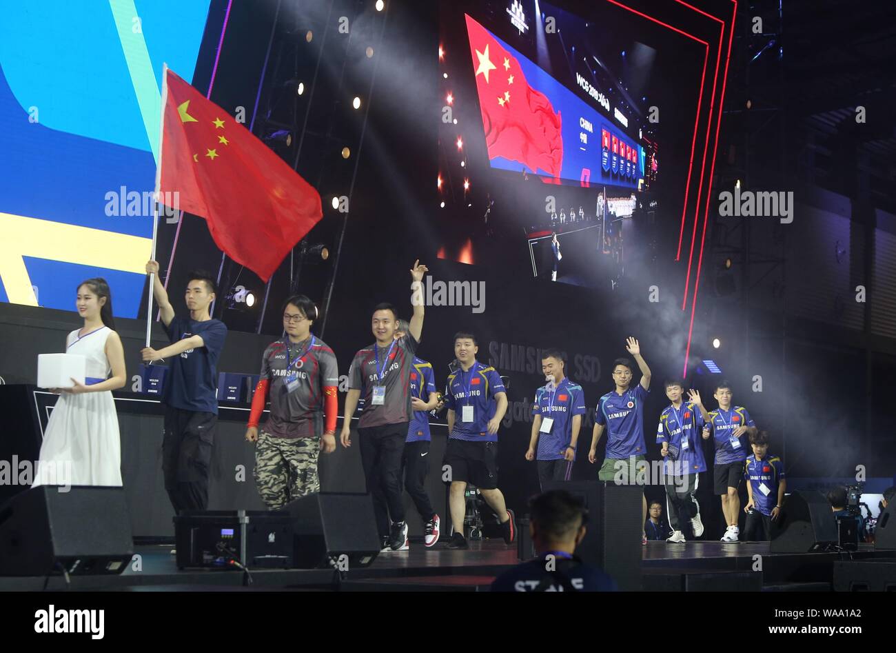 Participants pose before competing in the e-sports games during the WCG 2019 finals in Xi'an ...