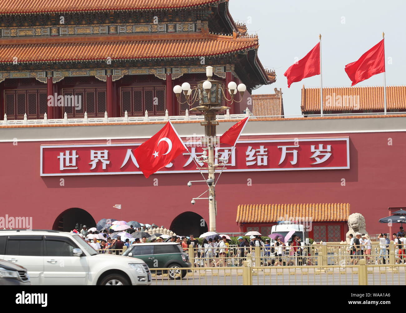 National flags of China and Turkey flutter on a lamppost in front of ...