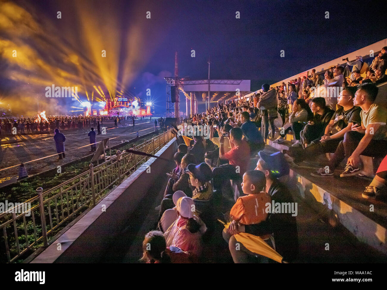 Chinese people of Yi ethnic group gather at a bonfire party to mark the ...