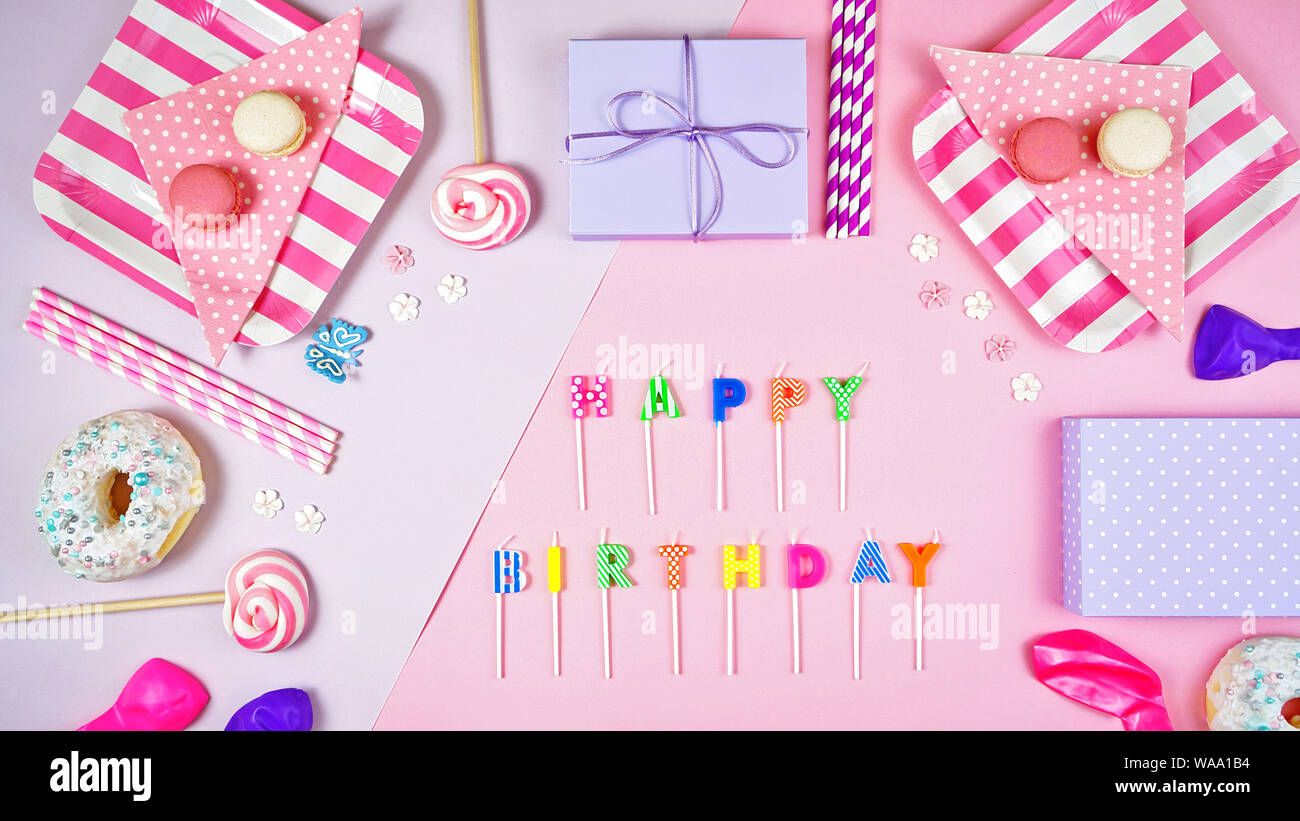 Colorful pink theme birthday party flat lay with party food, balloons ...