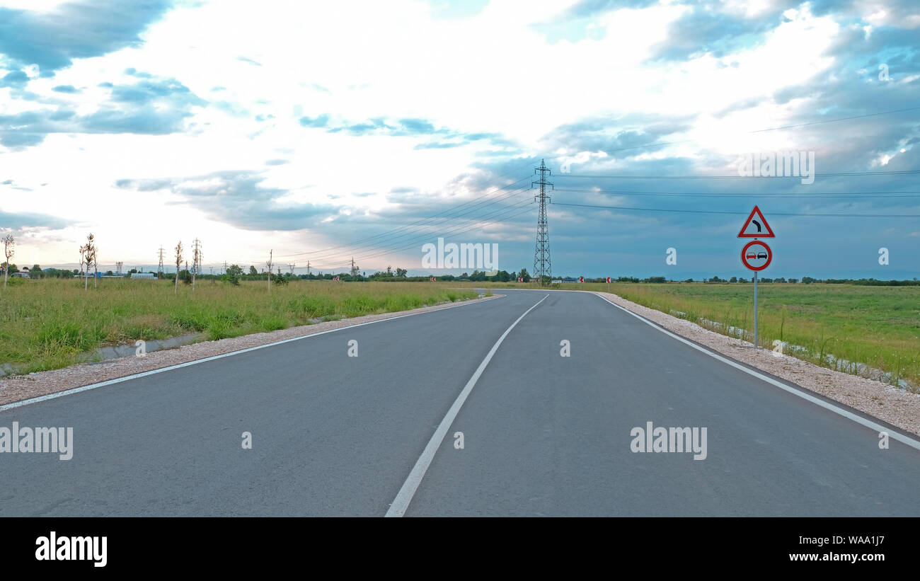 Repaired road before summer storm Stock Photo - Alamy
