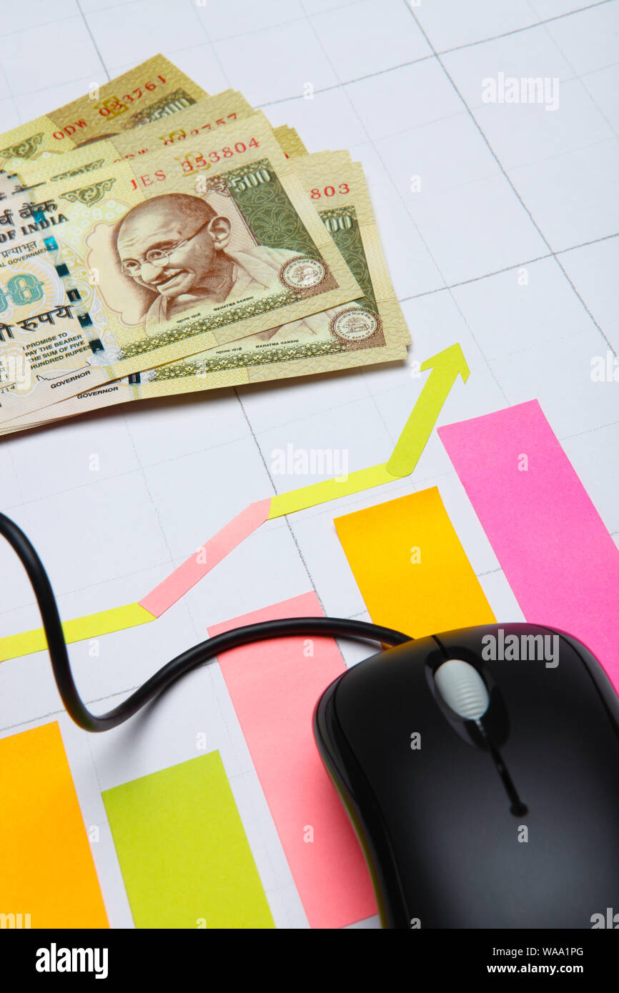 Five hundred rupee notes with bar graph and computer mouse Stock Photo ...