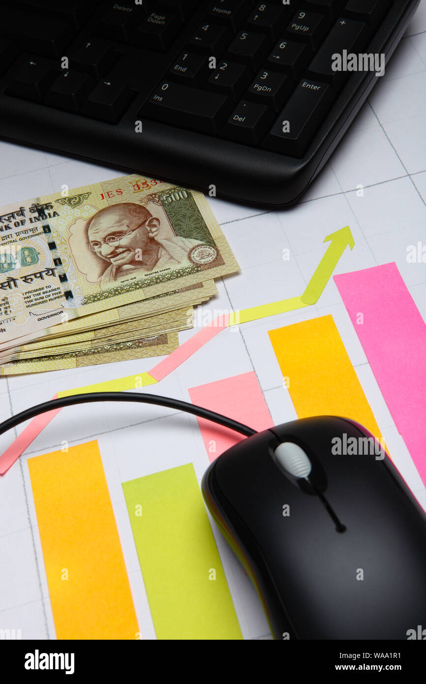 Five hundred rupee notes with bar graph and computer equipment Stock ...