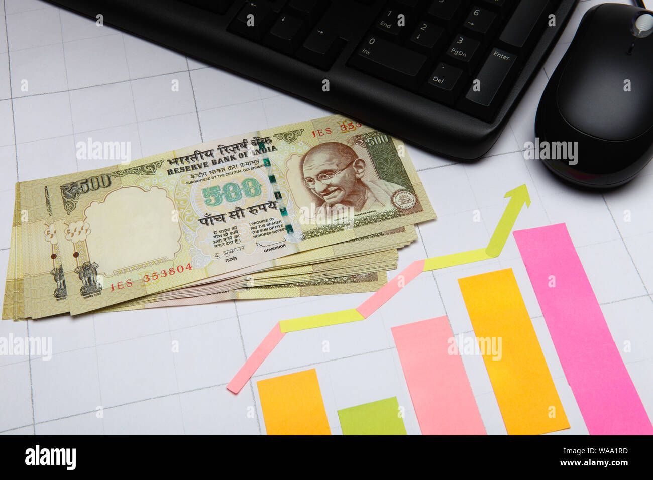 Five hundred rupee notes with bar graph and computer equipment Stock ...