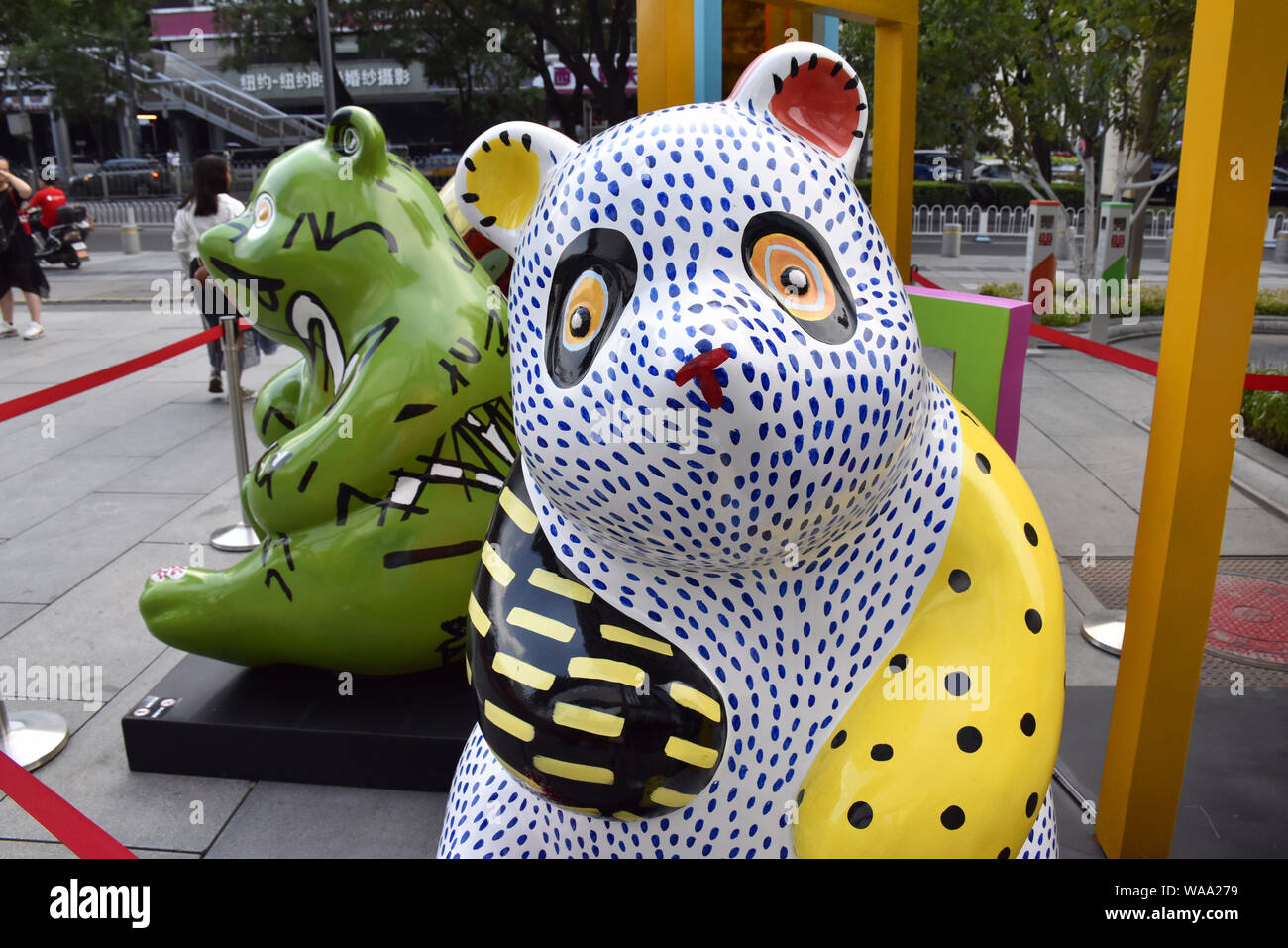 A sculpture featuring the shape of giant panda decorated with coloured ...
