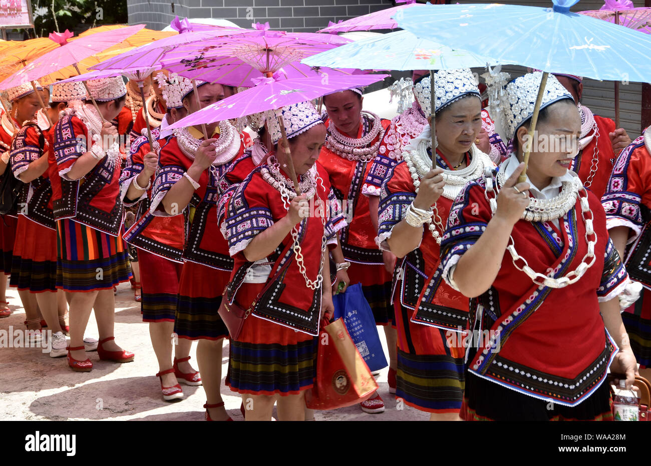 Chinese people of Miao ethnic group wearing traditional costumes and ...