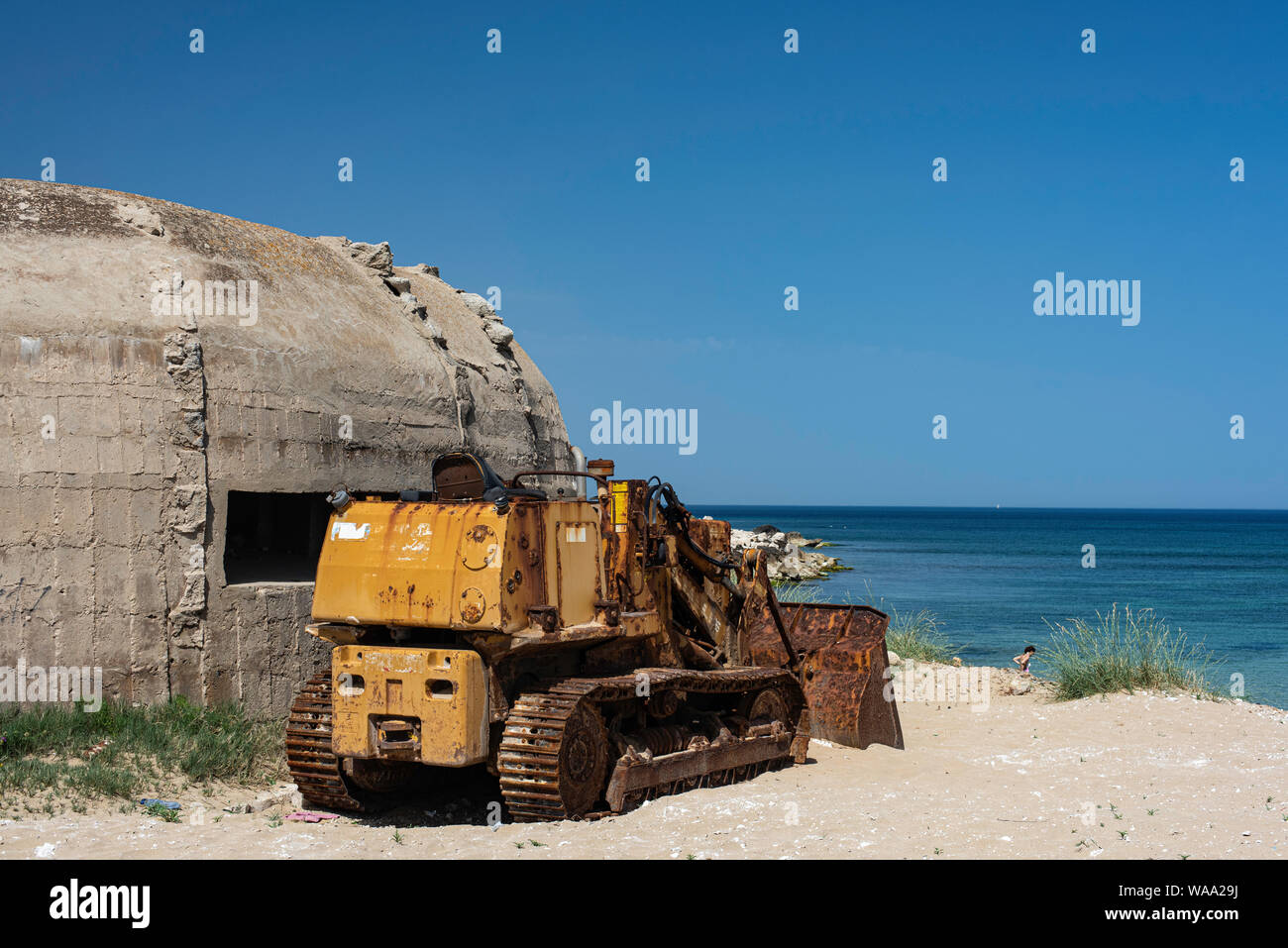 Bulldozer, used to flatten the sand and prepare the beach for the ...