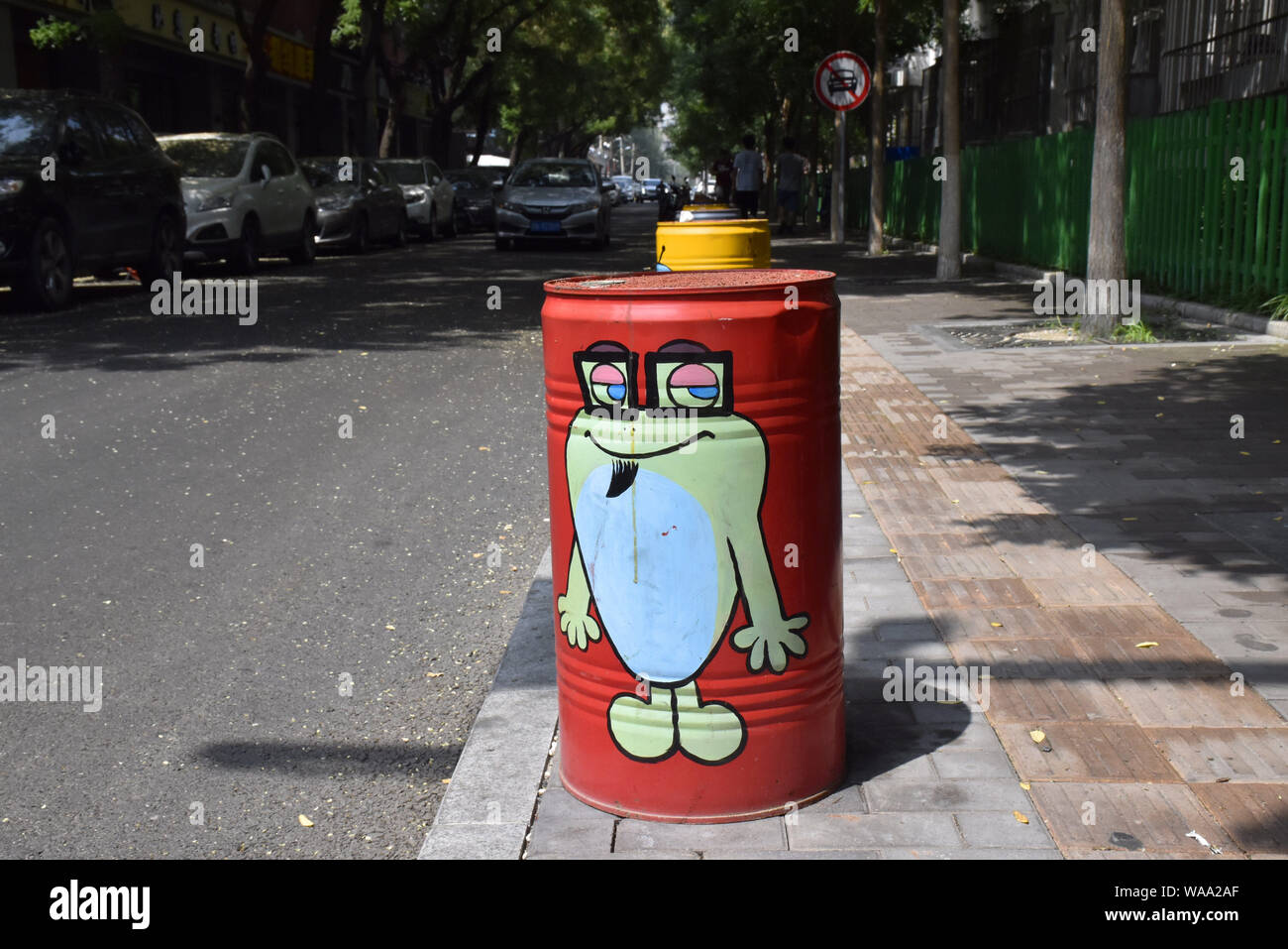 Hundreds of trash bins covered with cartoon characters and tips for ...