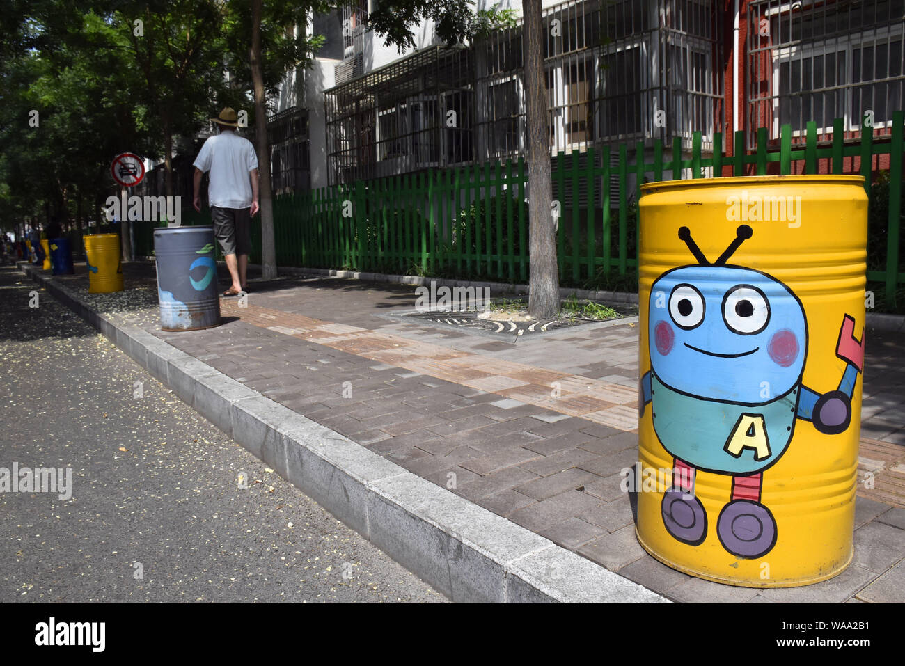 Hundreds of trash bins covered with cartoon characters and tips for ...