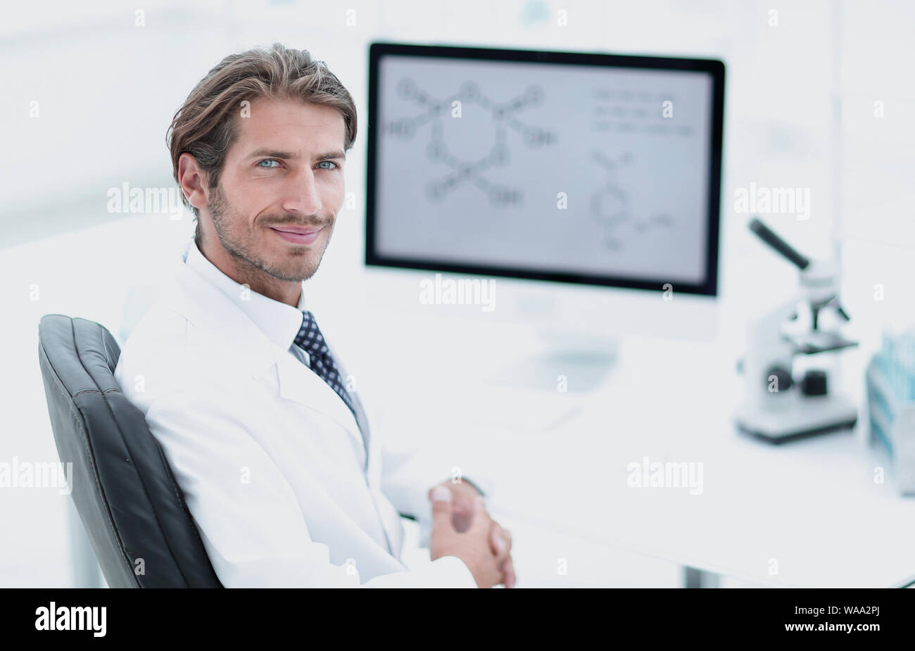 Scientist using computer and microscope in the laboratory Stock Photo ...