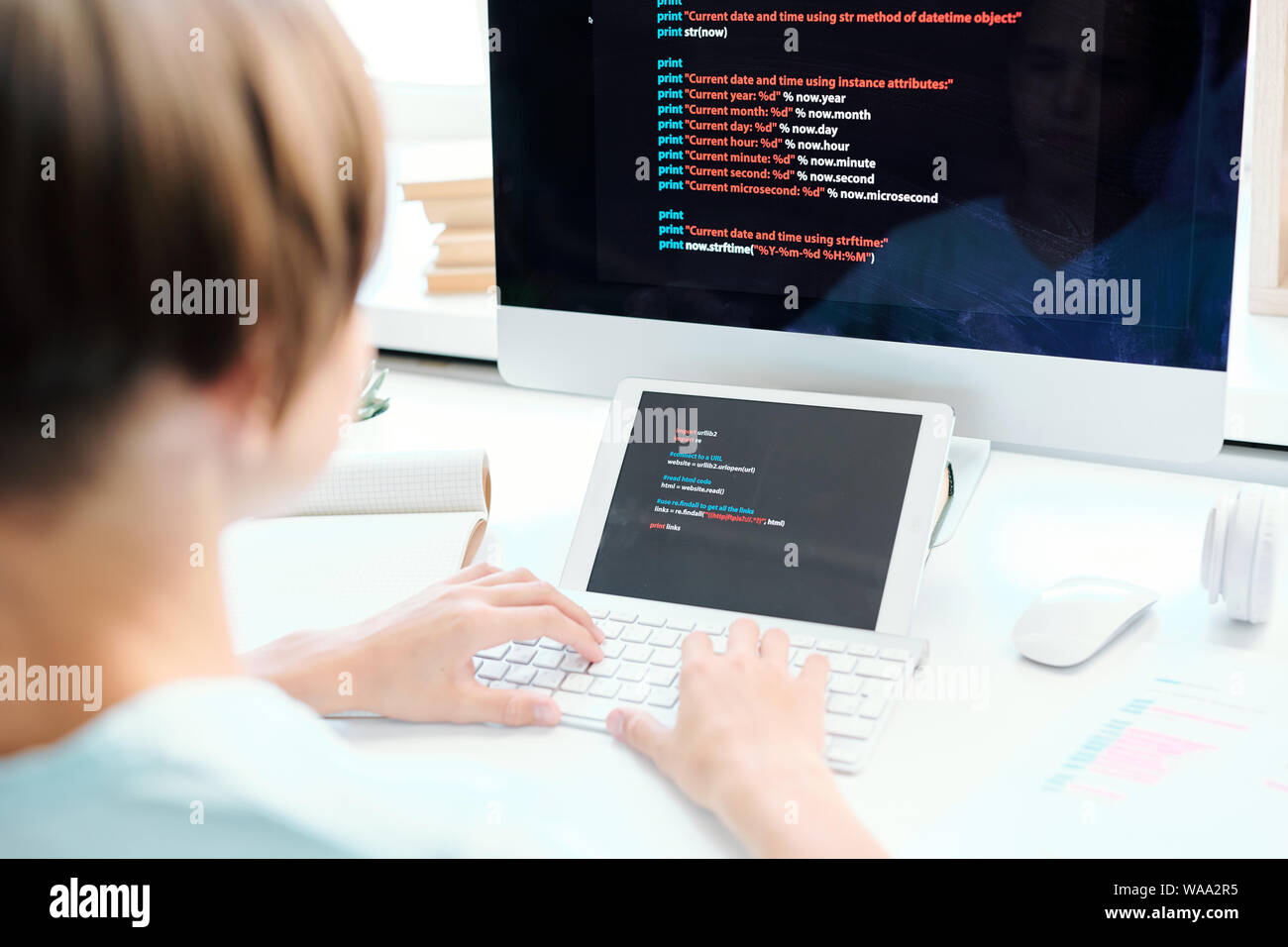 Human hands typing on desktop computer keypad in front of monitor Stock ...