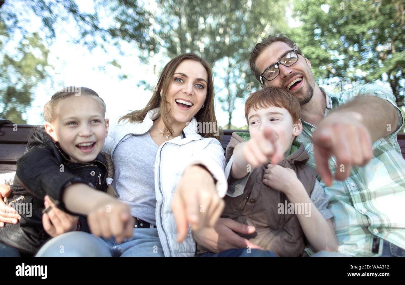 close up.smiling family pointing at you Stock Photo - Alamy