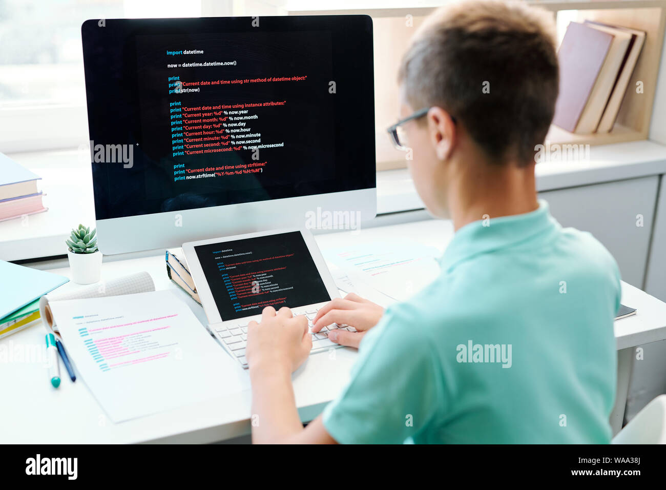 Mobile student of middle school typing on computer keypad Stock Photo ...