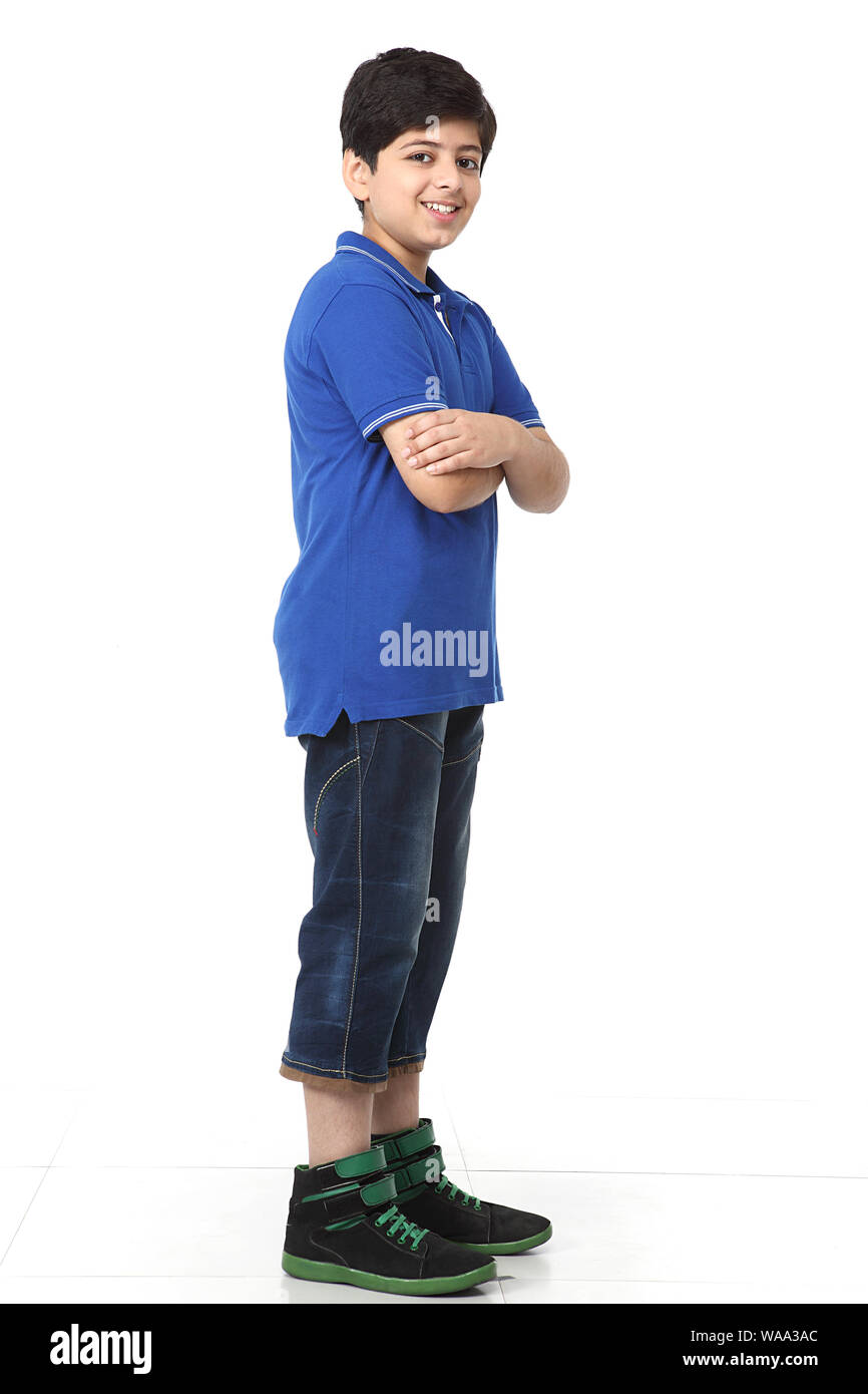 Boy standing with his arms crossed Stock Photo - Alamy