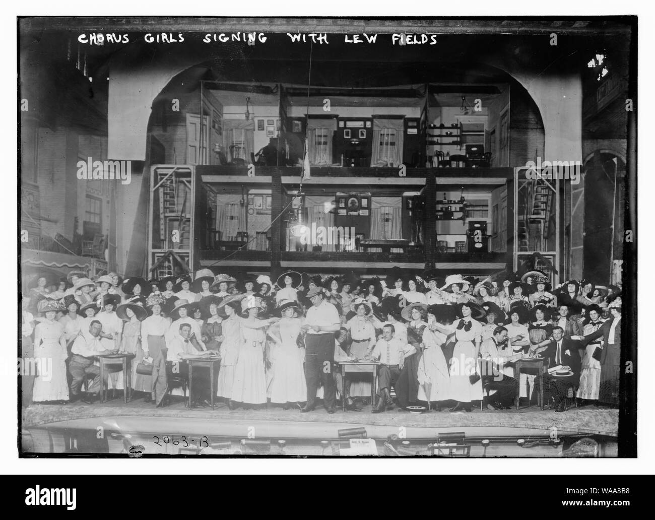 Chorus girls singing with Lew Fields Stock Photo - Alamy