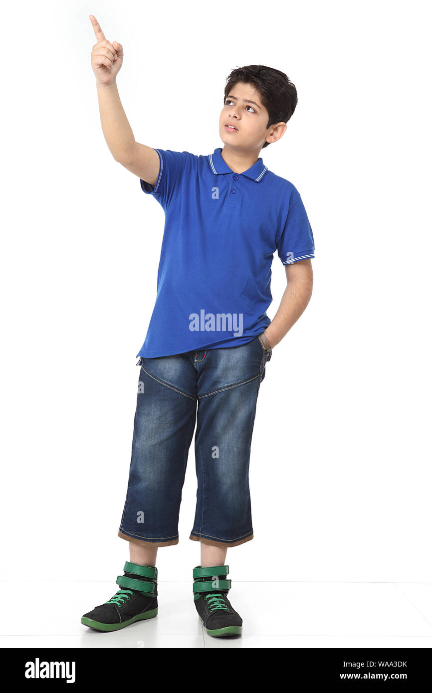 Boy standing pointing upward hi-res stock photography and images - Alamy