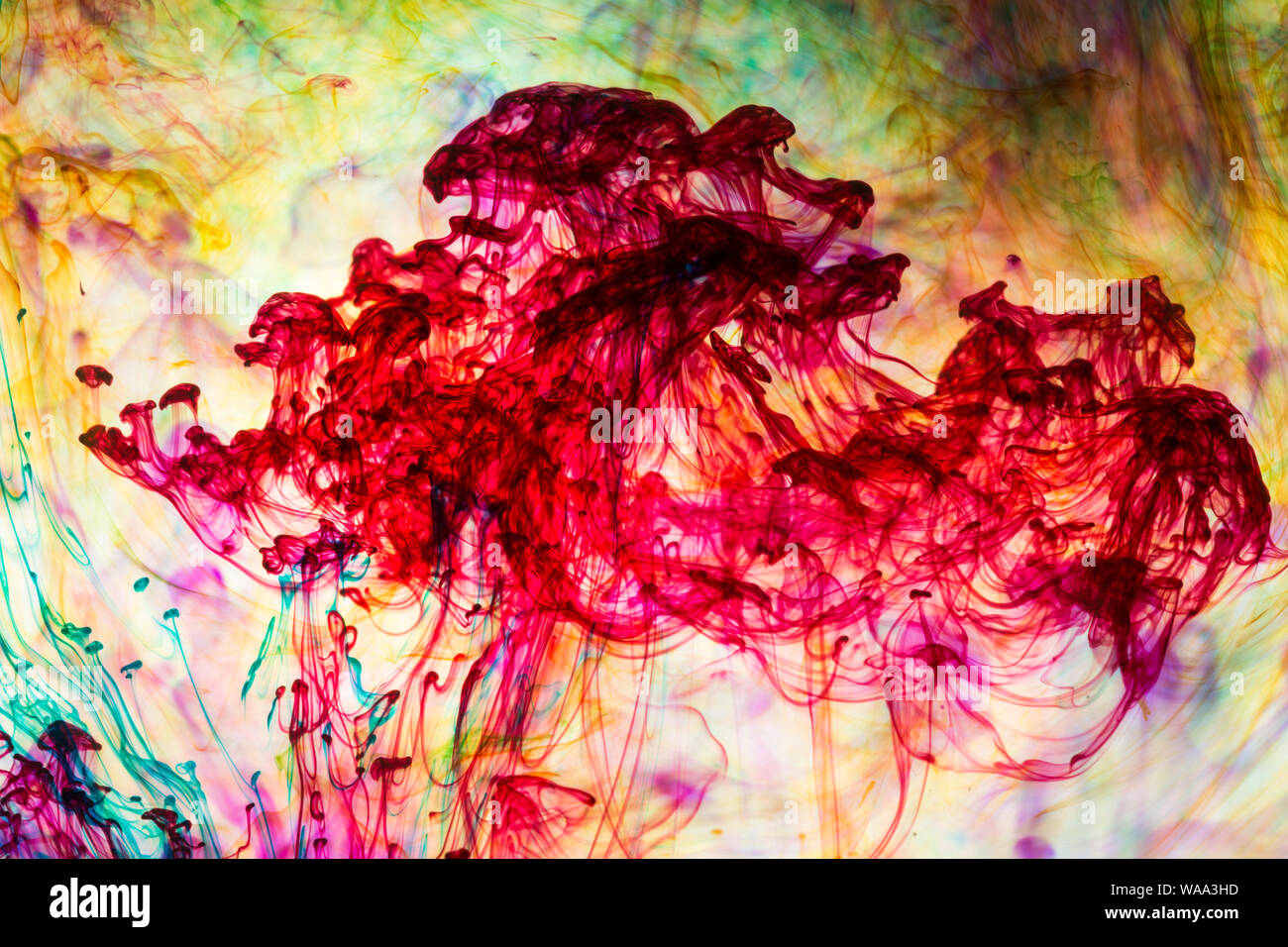 Acrylic colors and ink in water. Abstract background Stock Photo - Alamy