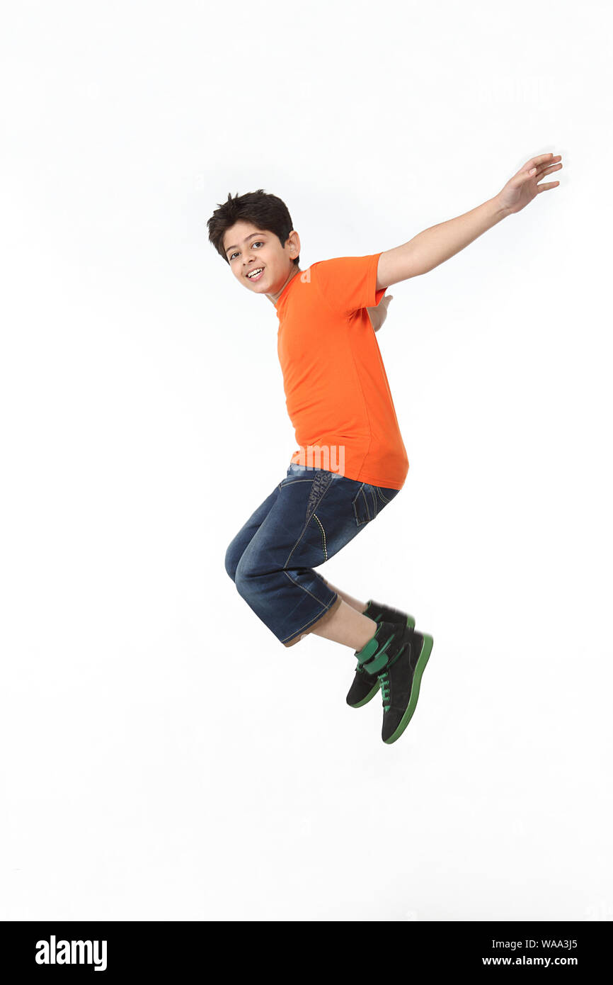 Boy jumping in air Stock Photo - Alamy