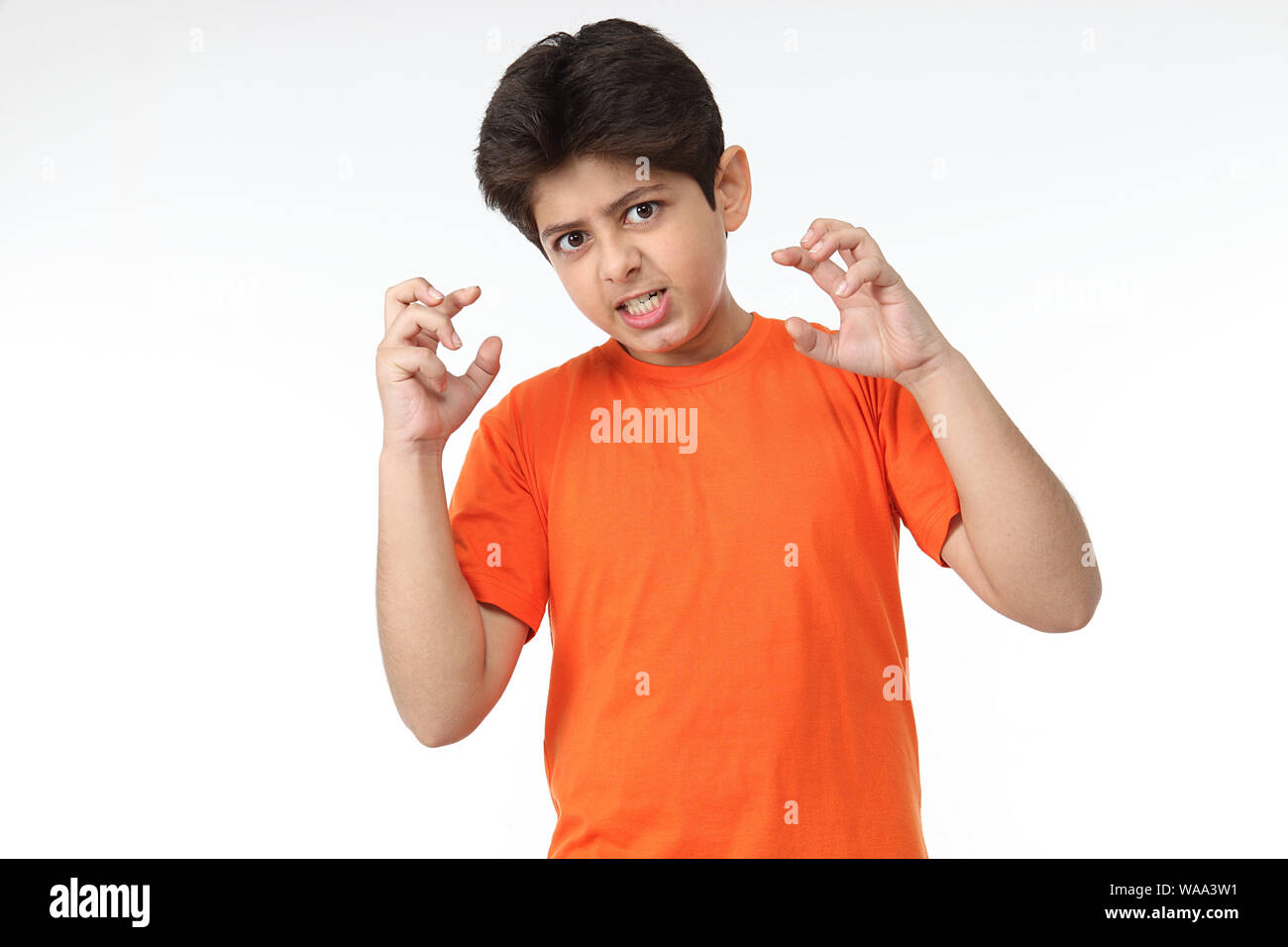Portrait of a boy looking angry Stock Photo - Alamy