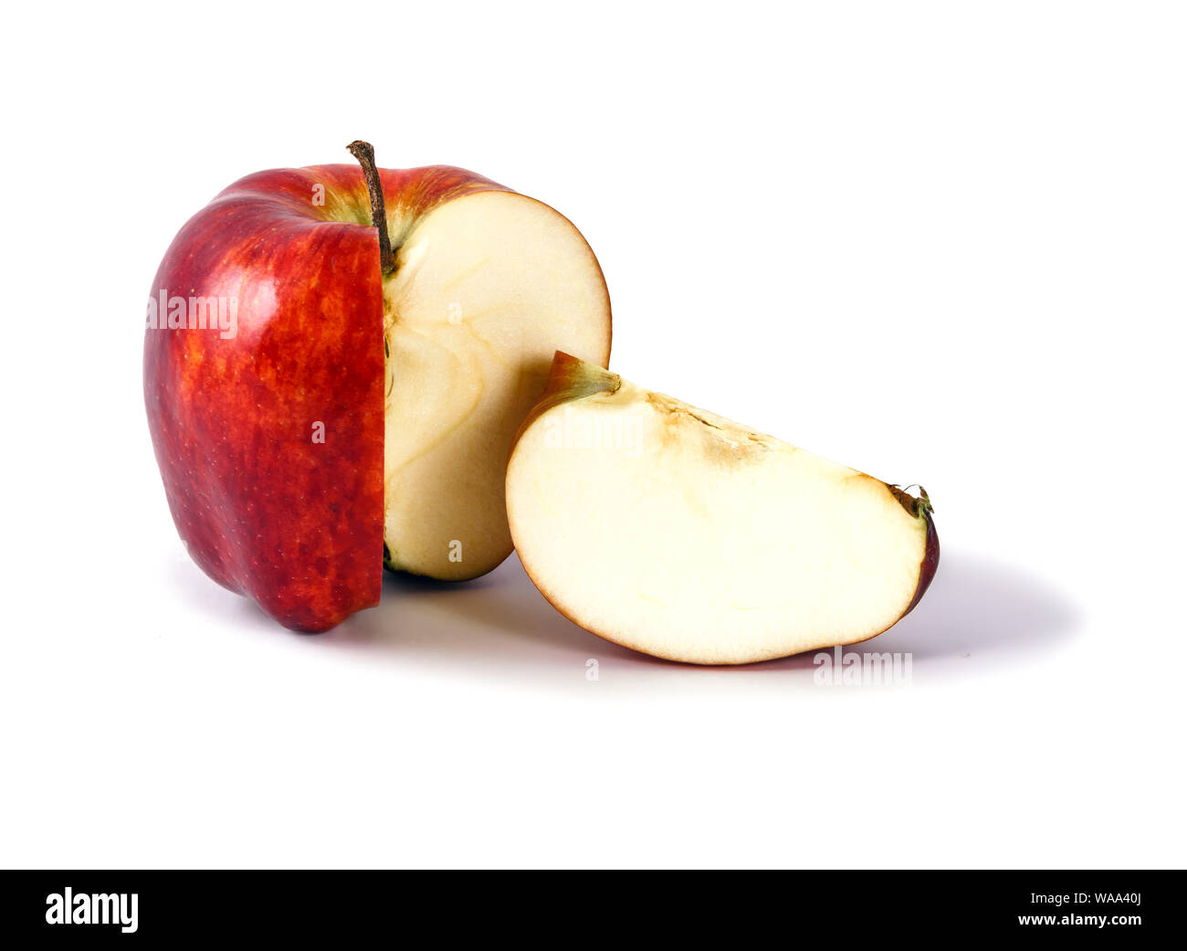 ripe red apple without a slice cut out close up on white background ...