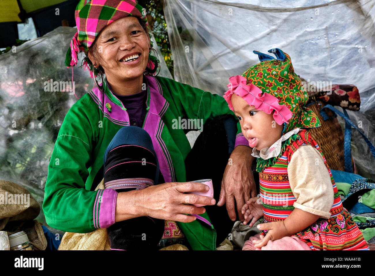 Sa Pa, Vietnam - August 24: Hmong woman with her daughter at the market ...