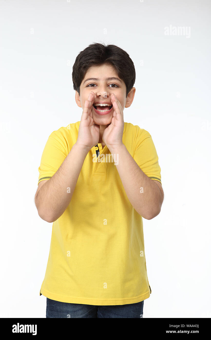 Boy covering mouth hands hi-res stock photography and images - Alamy