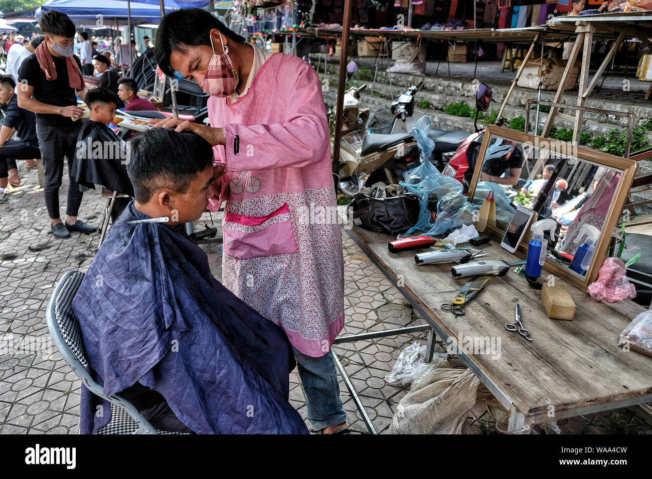 Unidentified barber on street hi-res stock photography and images - Alamy