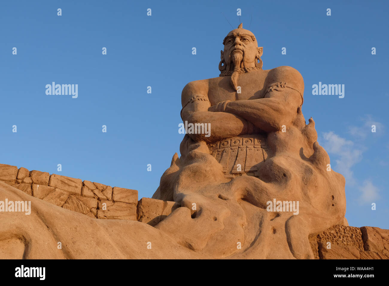 A sand sculpture of Disney's animated feature film Aladdin's Genie made ...