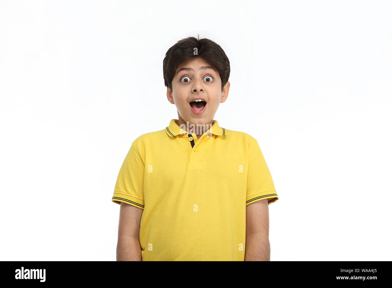 Portrait of a boy looking shocked Stock Photo - Alamy