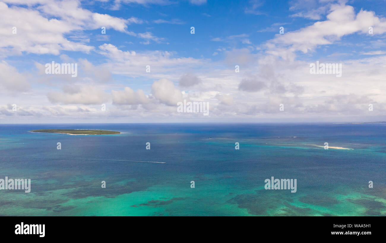 Seascape with coral reefs and islands. Tropical climate and nature of ...
