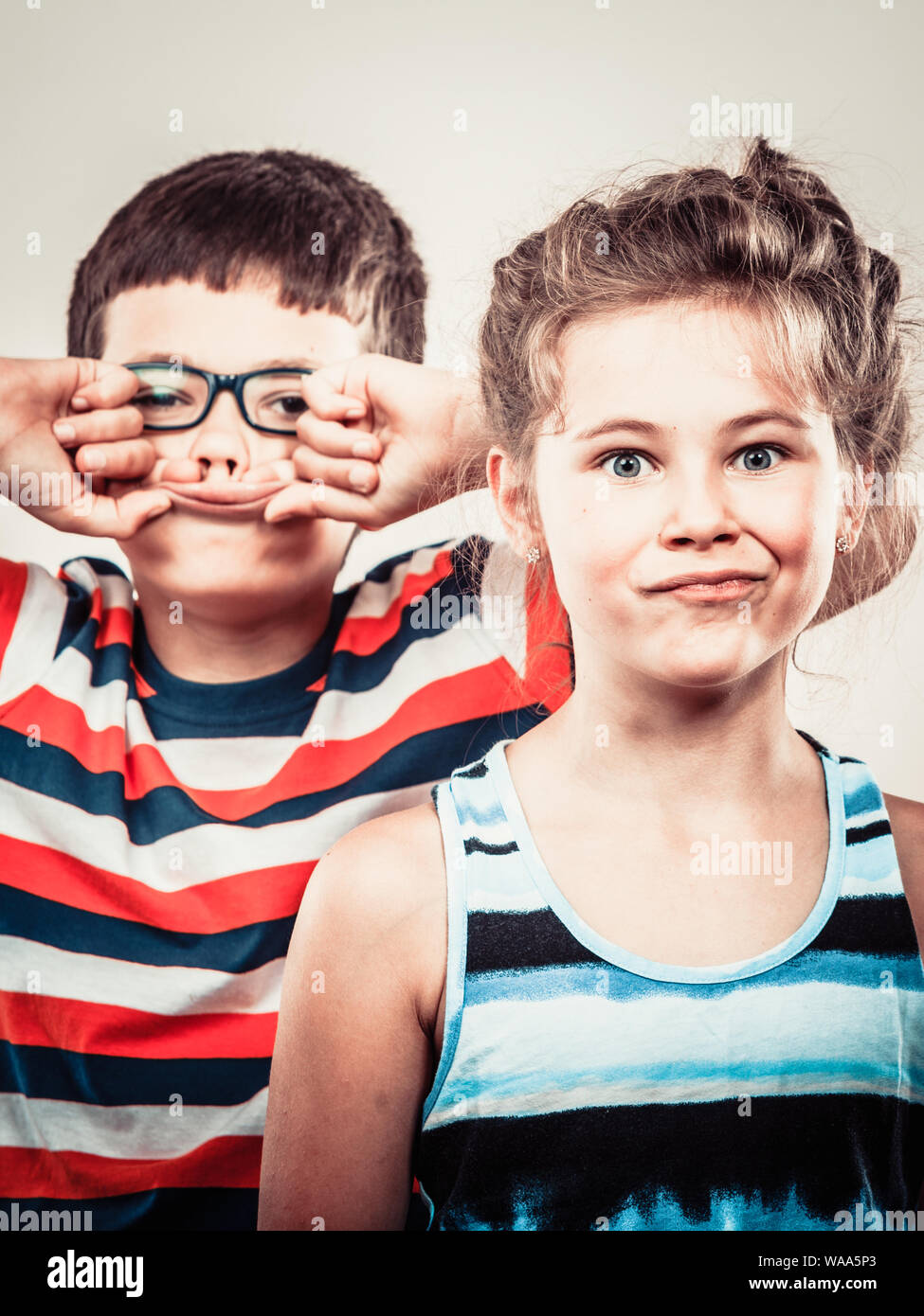 Crazy kids little girl and boy making silly face expression. Childhood ...