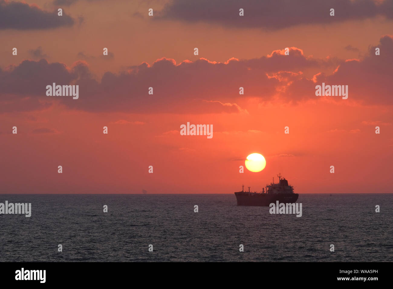 Sunset over the Mediterranean Sea across BLUE ROSE Chemical/Oil tanker ...