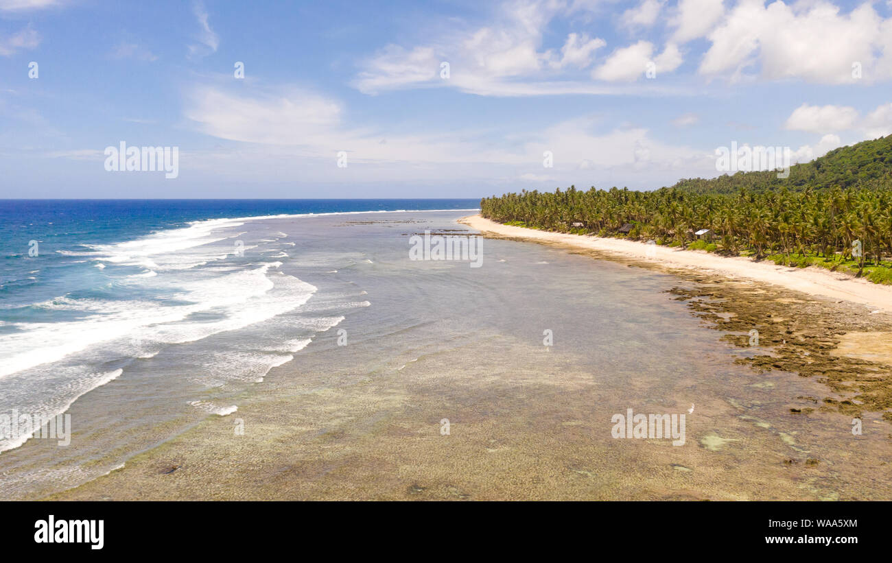 The rocky coast of a tropical island. Siargao, Philippines. Seascape ...
