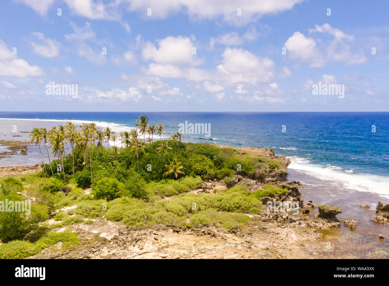 The rocky coast of a tropical island. Siargao, Philippines. Seascape ...