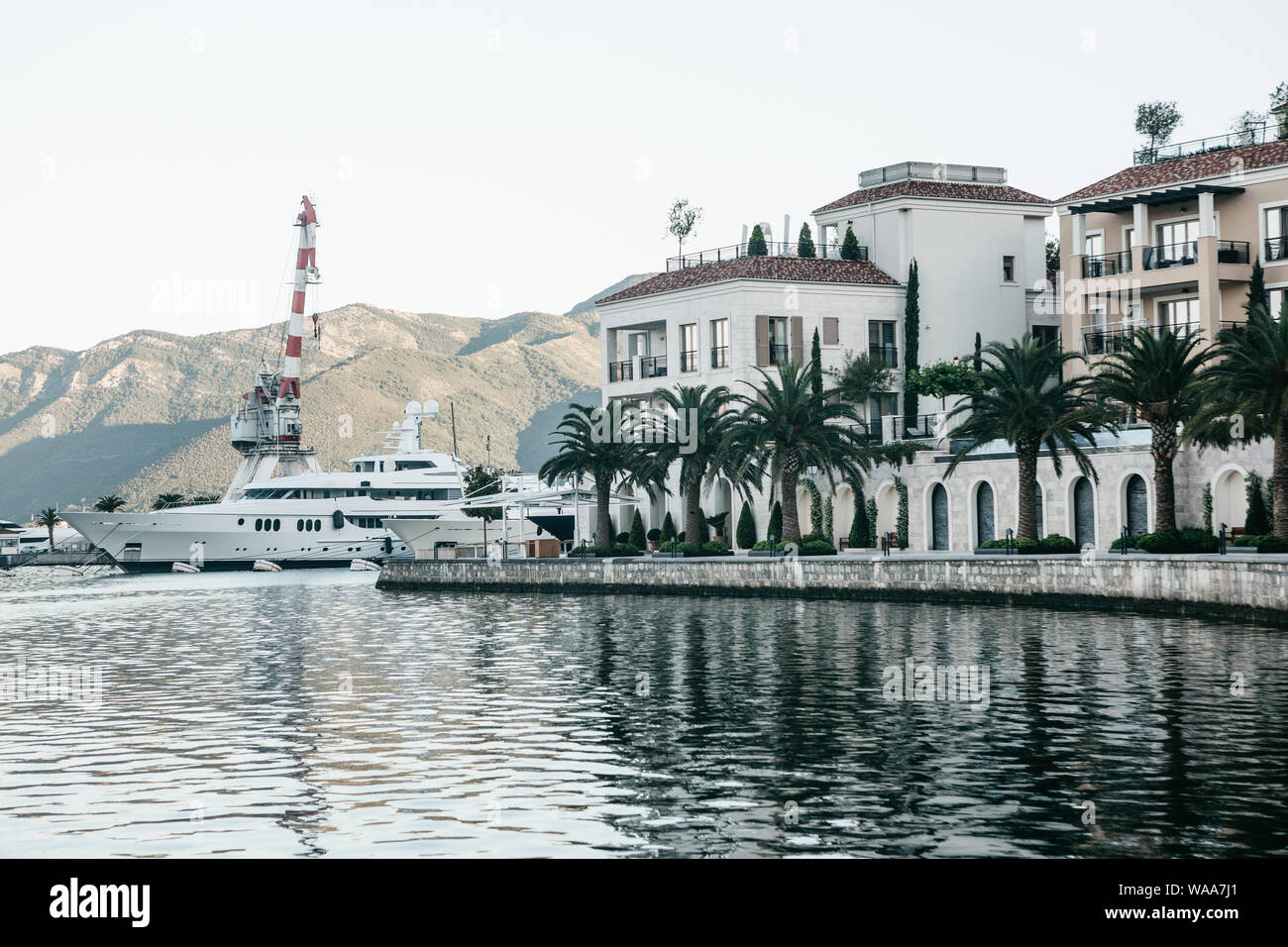 Crane building against backdrop mountains hi-res stock photography and ...