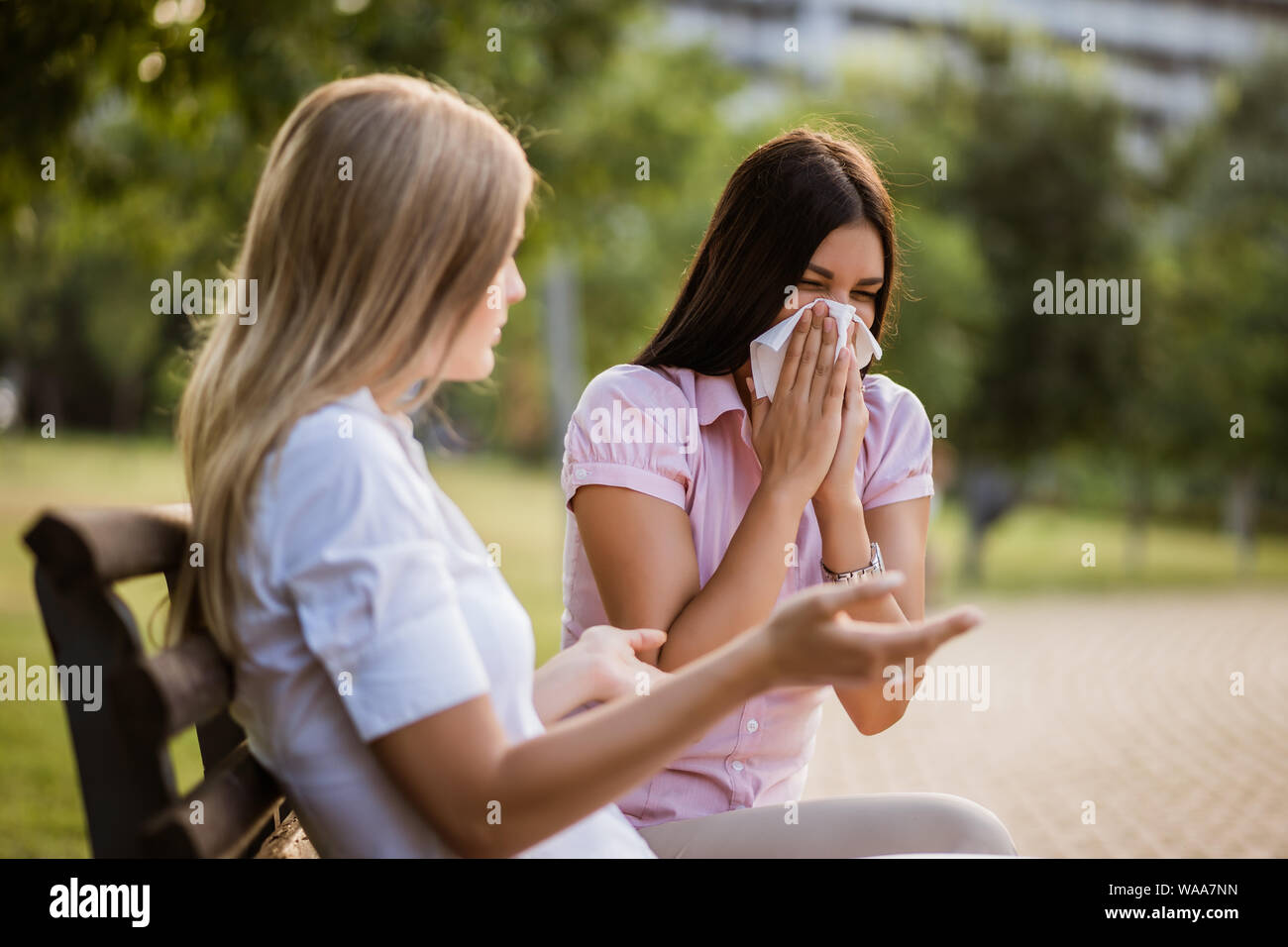 Two women are talking about allergy problems Stock Photo - Alamy