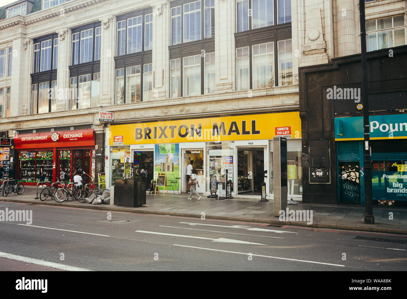 London / UK - July 16, 2019: people walking past the Brixton Mall ...