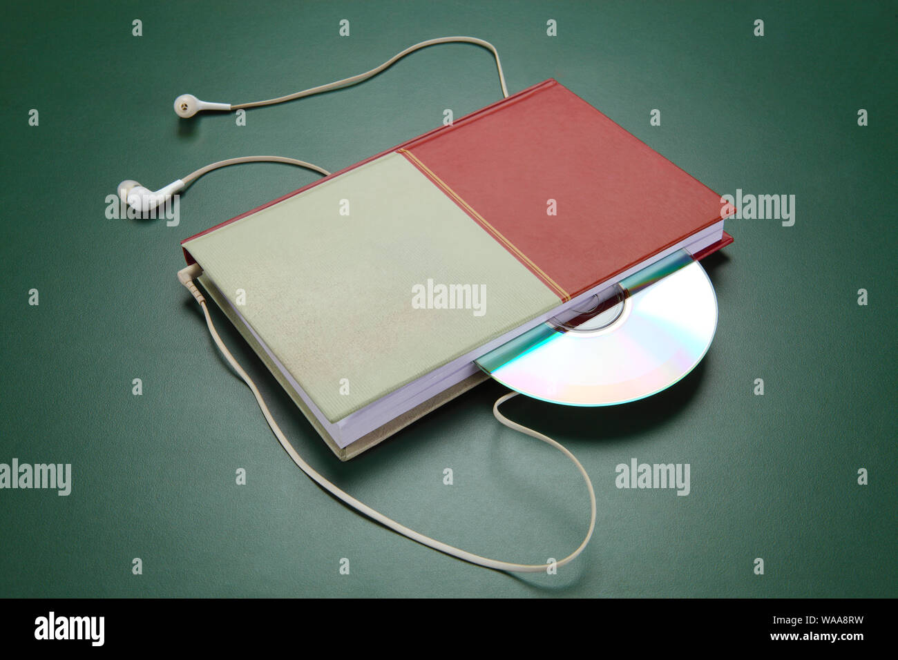 Book with a headphones and cd represent "Audiobook concept Stock Photo ...